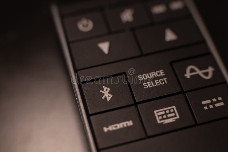 Small Black Remote with Focus on the Bluetooth and Source Select ...