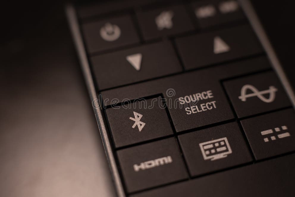 Small Black Remote with Focus on the Bluetooth and Source Select ...