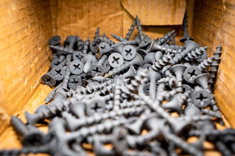 Small Black Wood Screws Close-up in a Cardboard Box Stock Photo - Image ...