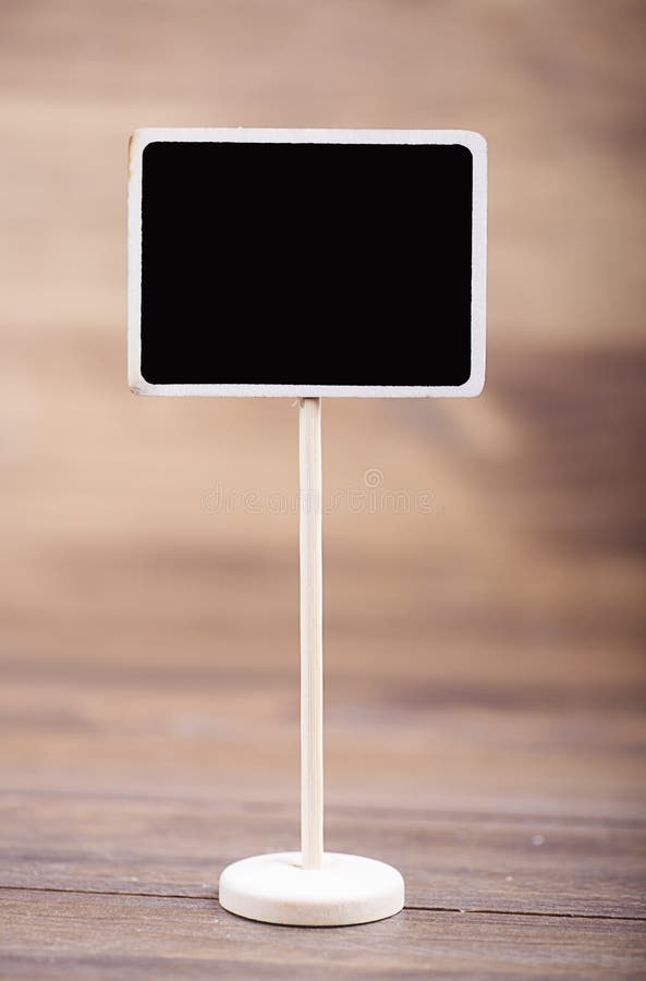 Small Blackboard Standing on Wooden Table. Stock Image - Image of small ...