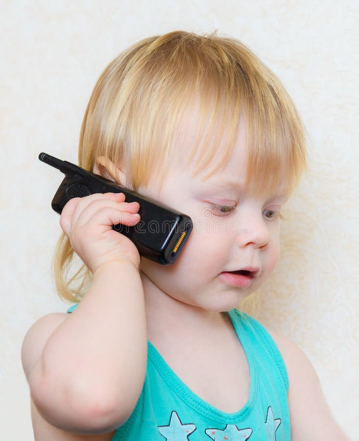 Small blond boy cell phone stock image. Image of joyful - 39276727