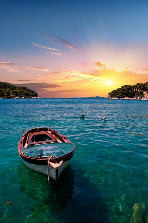 Blue Boat on Blue Water stock photo. Image of boat, peaceful - 121080860