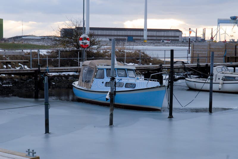 Small Blue Boat in a Frozen Harbour Stock Image - Image of boat ...
