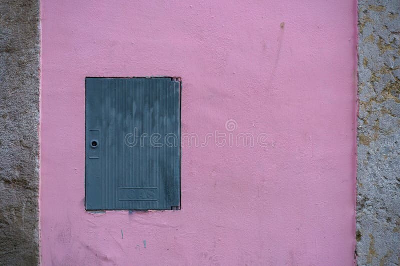 Small Blue Metallic Door on a Pink Wall Stock Image - Image of building ...
