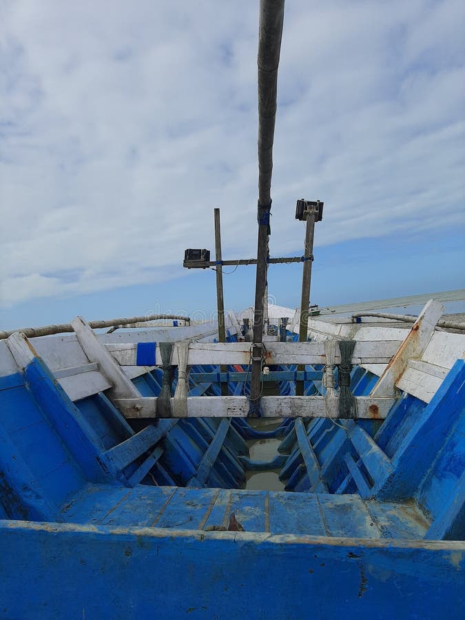 A Small Blue Ship at the Beach Stock Photo - Image of ship, beach ...