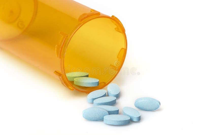 Small Blue Tablets Spilling Out of Prescription Container Stock Photo ...