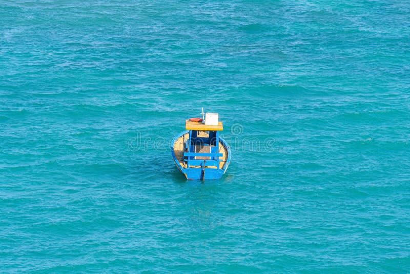 Small Blue and Yellow Boat in the Middle of the Sea Stock Image - Image ...