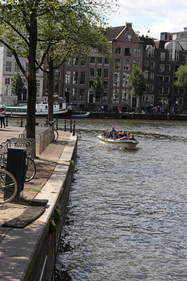 Small Boat Approaching on Amstel in Amsterdam Editorial Stock Image ...