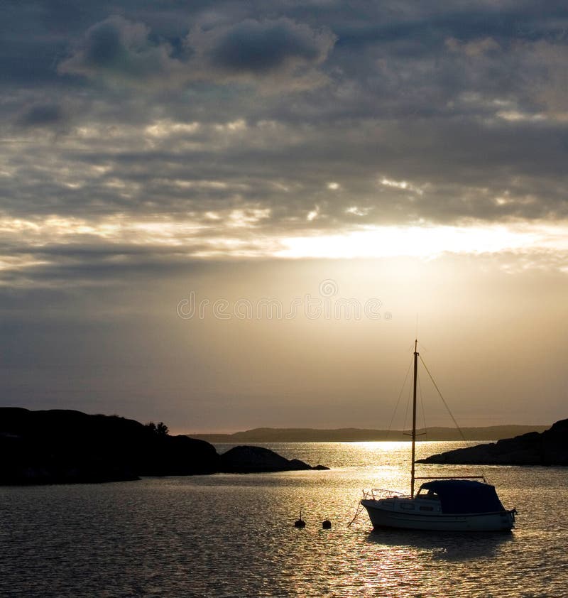 Small Boat and Cliffs during a Sunset Stock Image - Image of evening ...