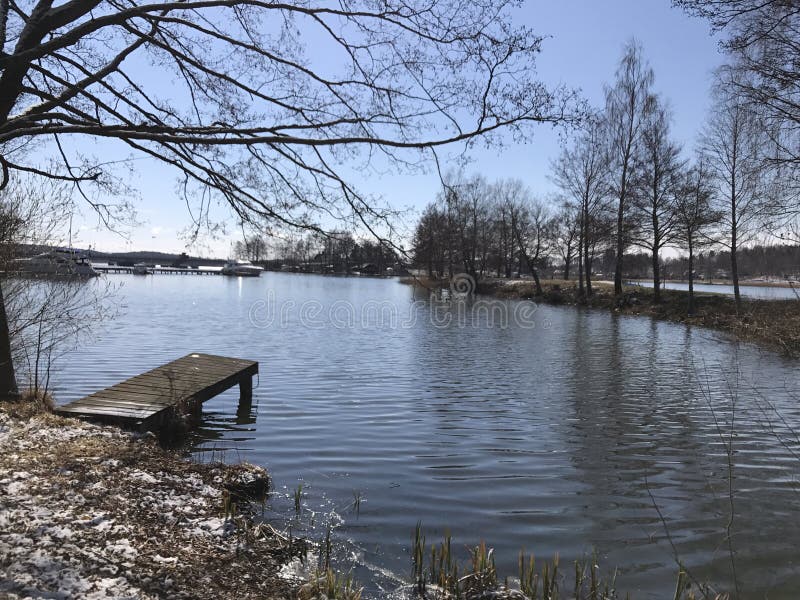 Small boat dock in winter editorial image. Image of water - 142601560