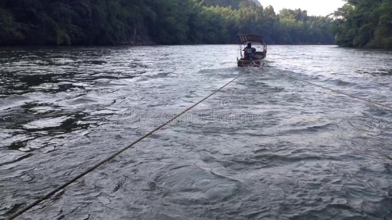 A Small Boat Dragged Behind a Passenger Ships Stock Footage - Video of ...