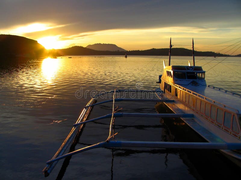 Small boat @ exotic sunset stock photo. Image of morning - 234572