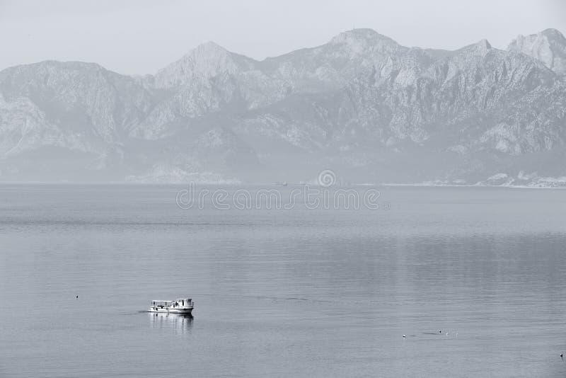 Small Boat in Front of Mountain and Sea View Stock Image - Image of ...
