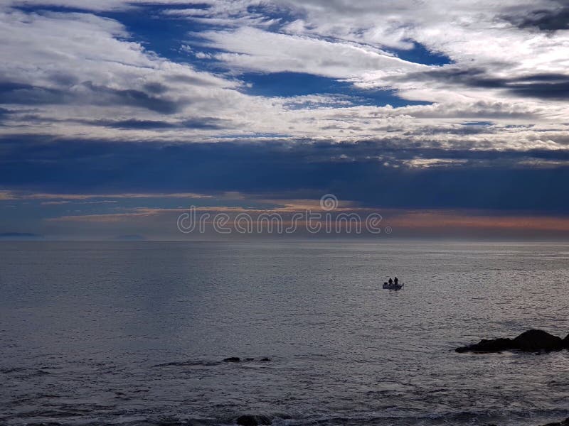 Isolated Boat on the Ocean at Dawn Stock Photo - Image of remote ...