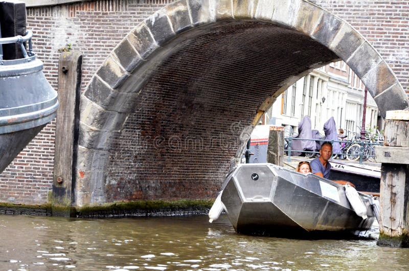 Small Boat Passing Under a Bridge Editorial Stock Image - Image of traditional, city: 81940794