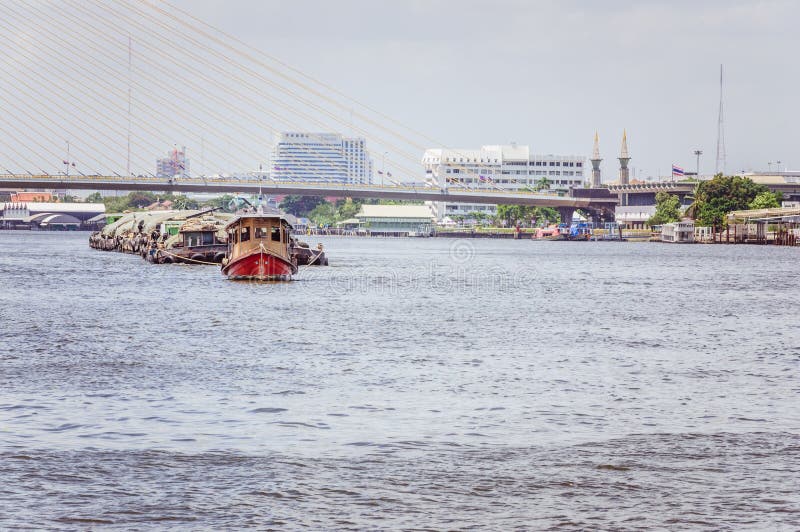Small Boat Pulling Commercial Barge on Chao Phraya River Stock Photo ...