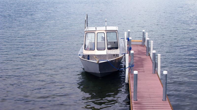 Small Boat Tied To Narrow Dock Stock Image - Image of wooden, watery ...