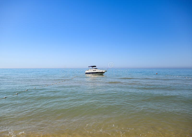 A Small Boat Yacht in the Sea Near the Shore. Stock Photo - Image of ...
