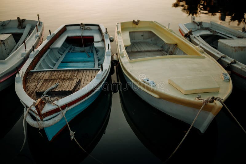 Small Boats on Calm Water, Moored in the Harbor during Sunset. Stock ...