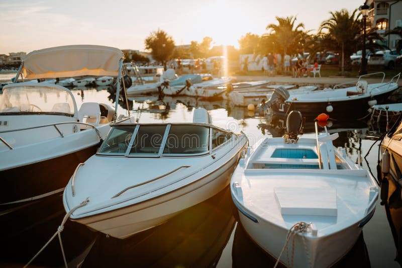 Small Boats on Calm Water, Moored in the Harbor during Sunset ...