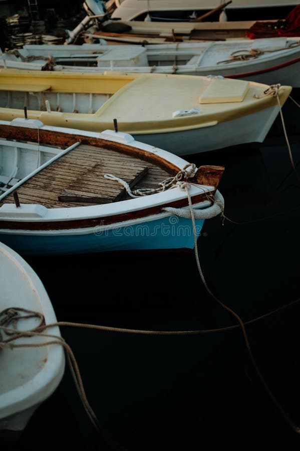 Small Boats on Calm Water, Moored in the Harbor during Sunset. Stock ...