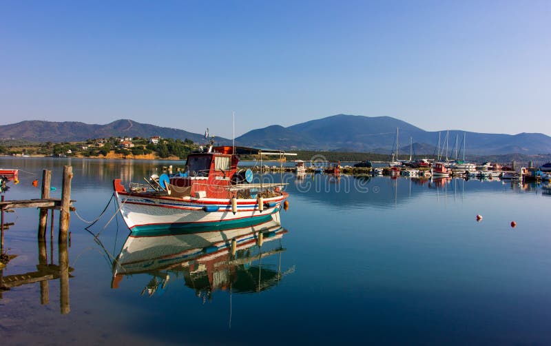 Small boats in Greek editorial stock image. Image of port - 57230194