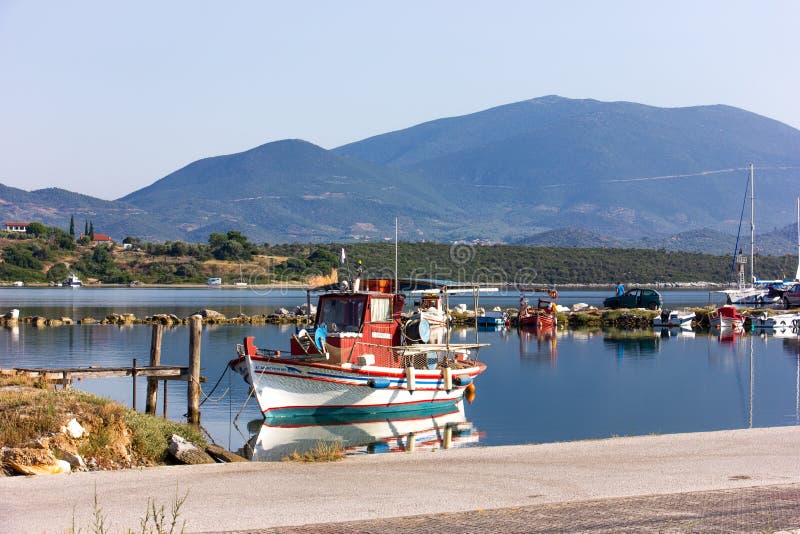 Small boats in Greek editorial photo. Image of coast - 57230201