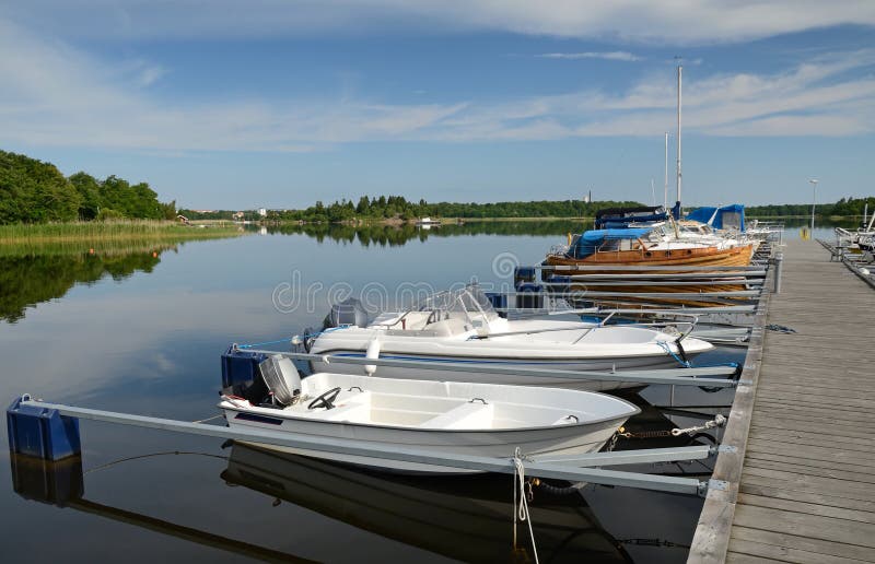 Small boats in the harbor stock photo. Image of coast - 25554802
