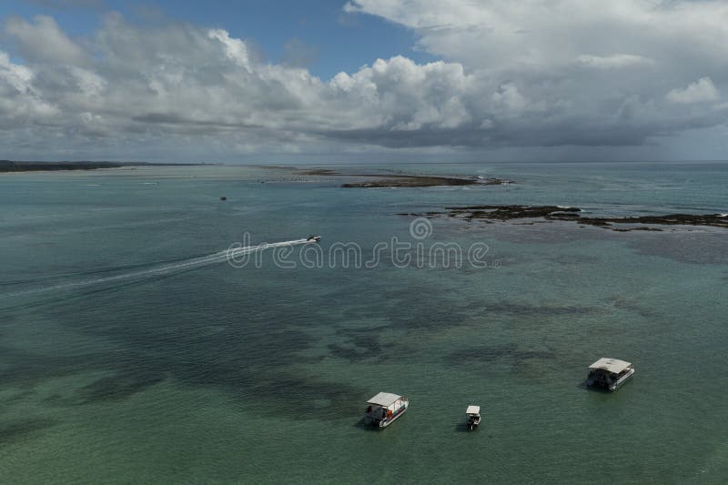 Small Boats in the Middle of Natural Pools Formed by Reefs Stock Image ...