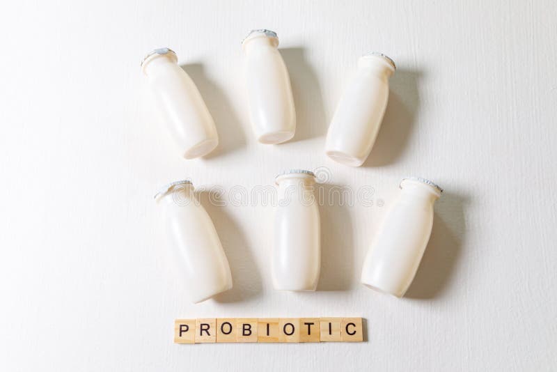 Small Bottles with Probiotics Prebiotics Dairy Drink on White ...