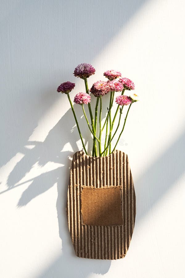 Small Bouquet of Flowers in Cardboard Vase Stock Photo - Image of ...