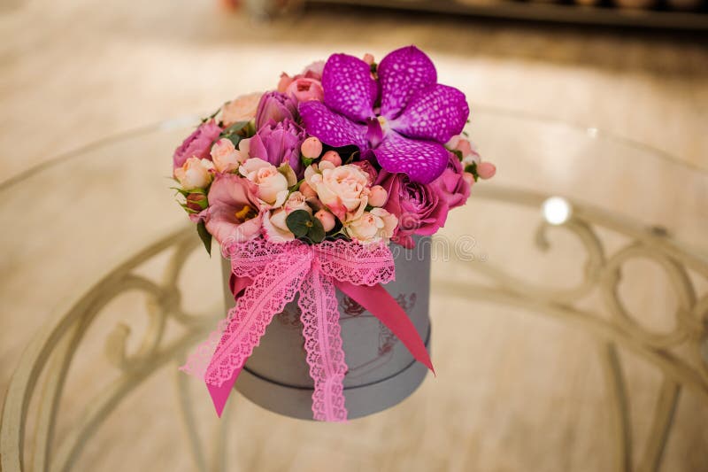 Small Bouquet of Pink and Purple Flowers in Box Stock Photo - Image of ...