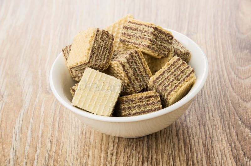 Small Bowl with Waffle Cubes on Table Stock Image - Image of glass ...