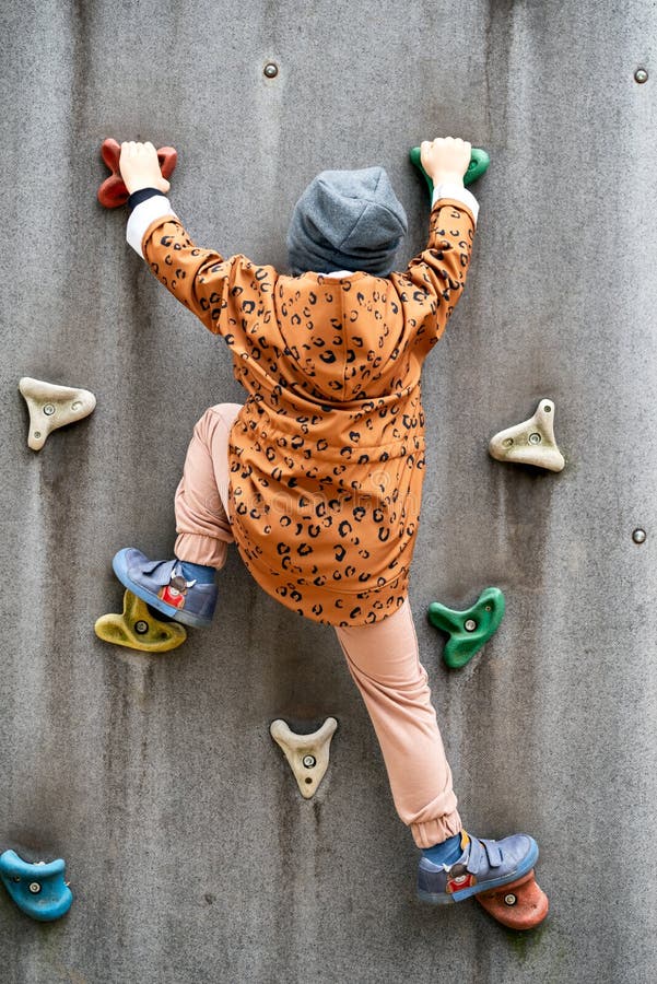Small Boy Climbing a Rock Wall at Playground Stock Image - Image of ...
