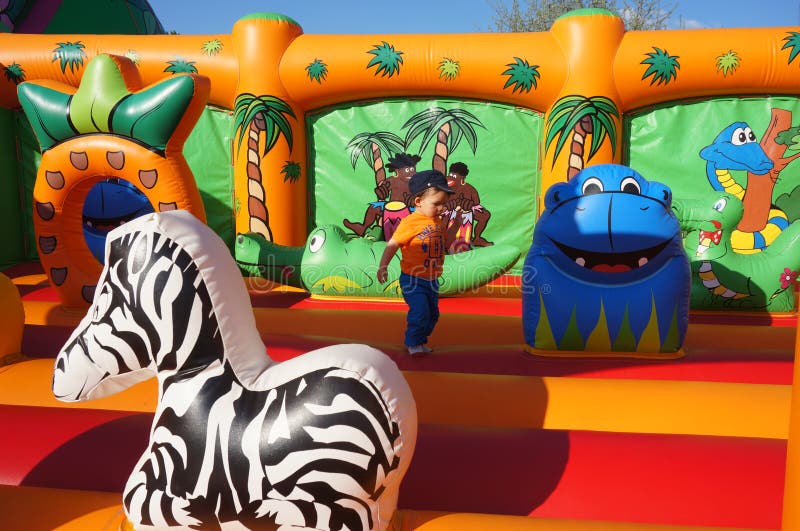 Young boy in a jump castle editorial photo. Image of inflatable - 200162521