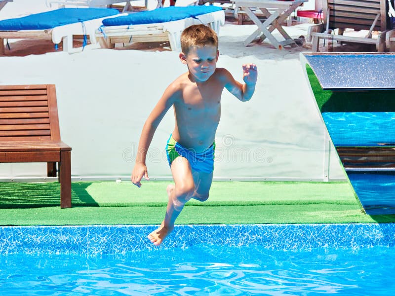 Boy jumping into the pool stock image. Image of pool - 28621391