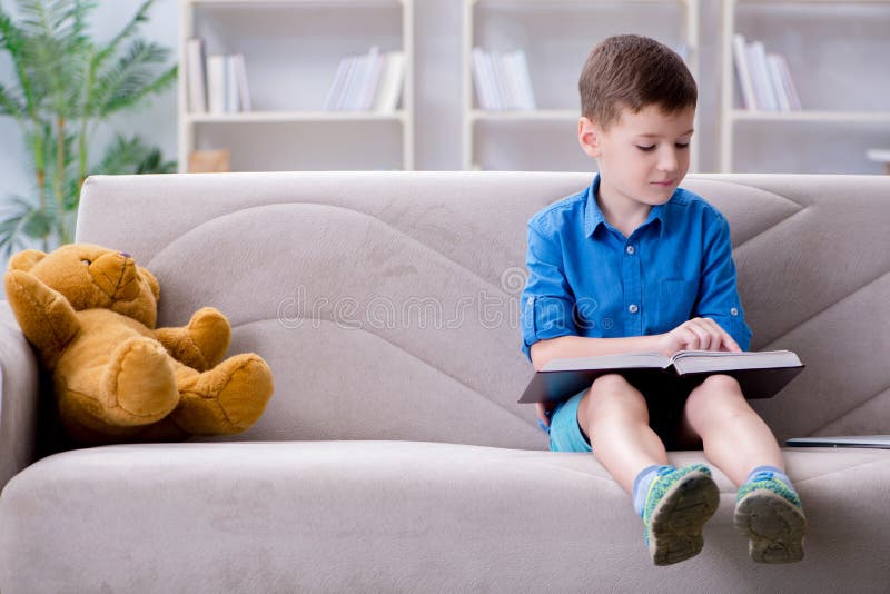 The Small Boy Reading Books at Home Stock Photo - Image of book ...
