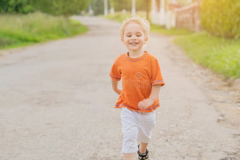 Small Boy Running Forward. he is Happy and Funny Stock Photo - Image of ...