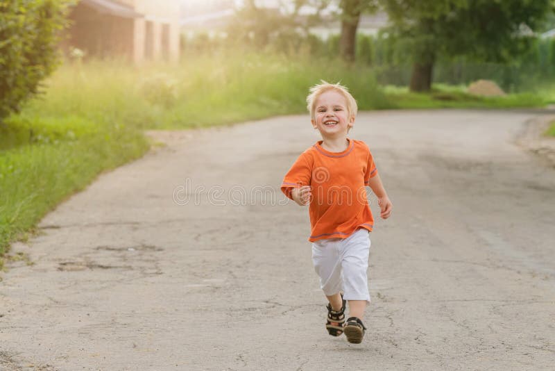 Small Boy Running Forward. he is Happy and Funny Stock Photo - Image of ...