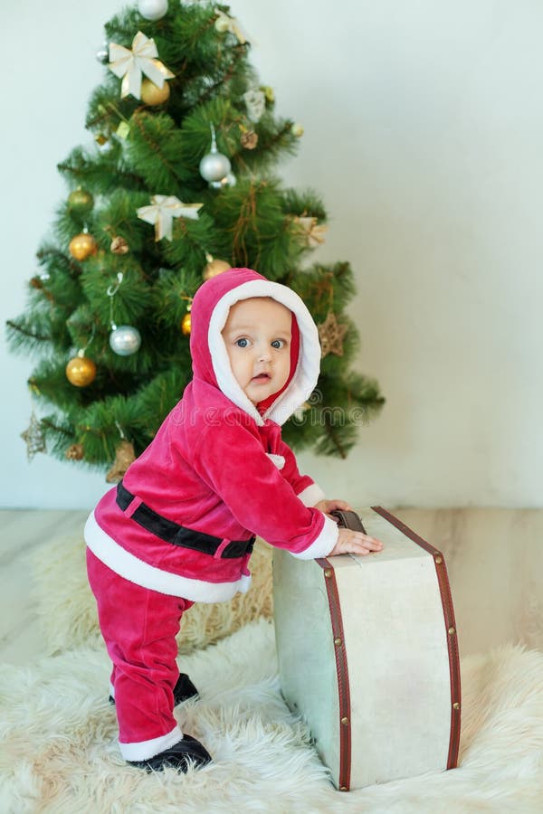 Small Boy in Santa Suit Plays in White Studio Stock Image - Image of ...