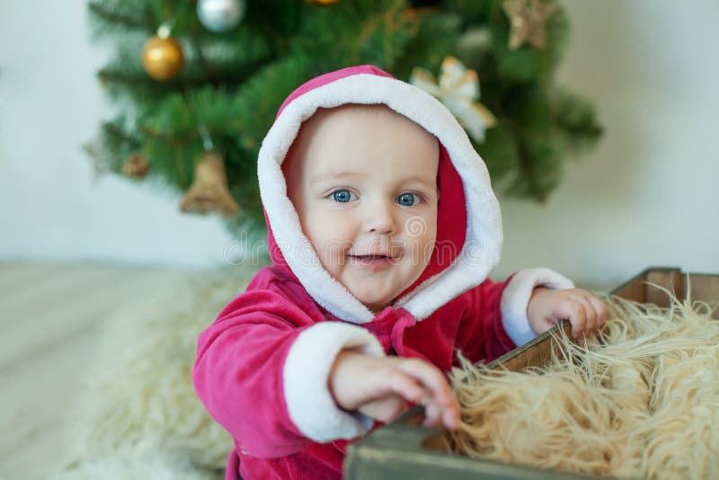 Small Boy in Santa Suit Plays in White Studio Stock Photo - Image of ...