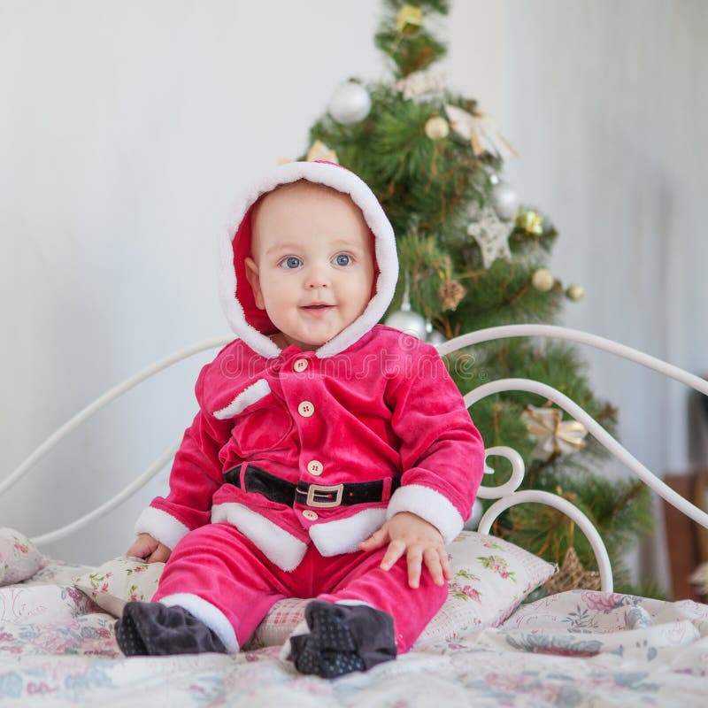 Small Boy in Santa Suit Plays in White Studio Stock Photo - Image of ...