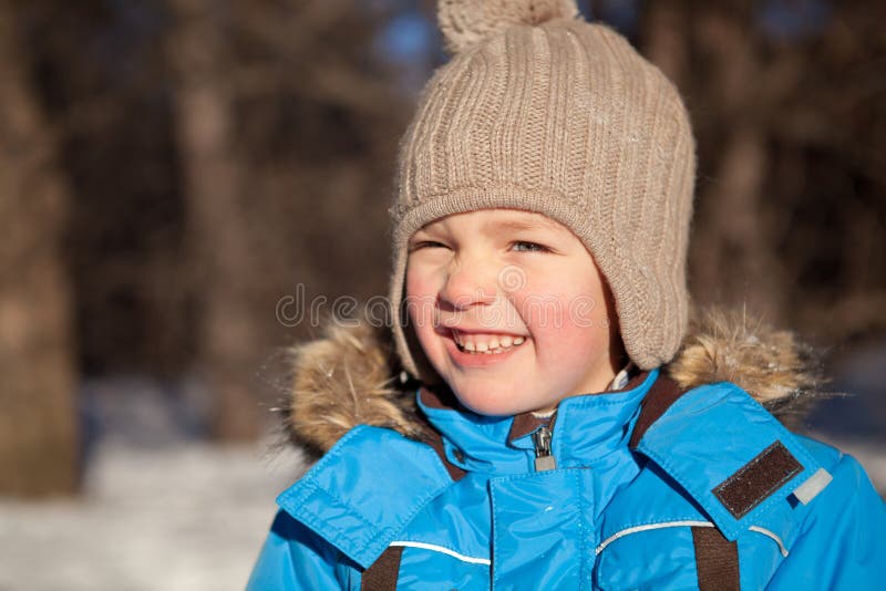 Small Boy Squinted at Sun, Winter, Park Stock Photo - Image of snow ...