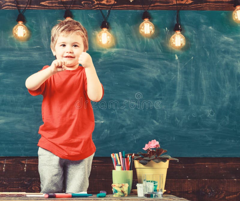 Small Boy Standing Behind the Table. Cute Kid Boxing in the Classroom ...