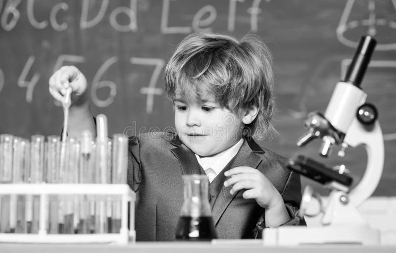 Small Boy Using Microscope at Lesson. Microscope at Lab. Back To School ...