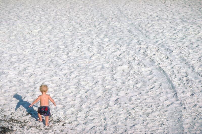Small boy walking on beach stock image. Image of oceanfront - 1111651