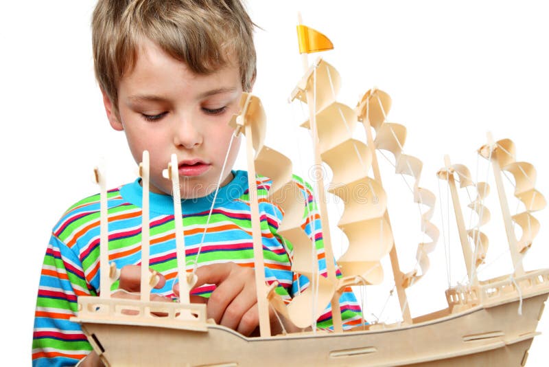 Small Boy Work with Zeal on Artificial Ship Stock Photo - Image of ...