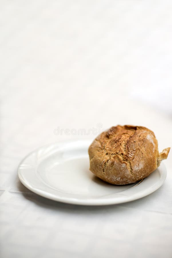 Small Bread on White Plate, Space for Text Stock Photo - Image of ...