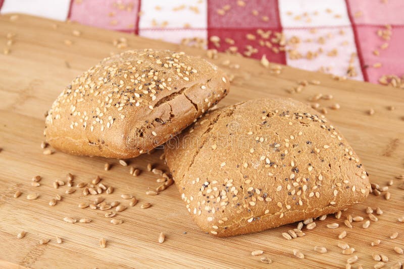 Small Bread on Wooden Board Stock Image - Image of breakfast, black ...