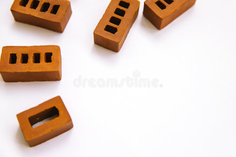 Small Bricks are Scattered on a White Background. Children`s ...